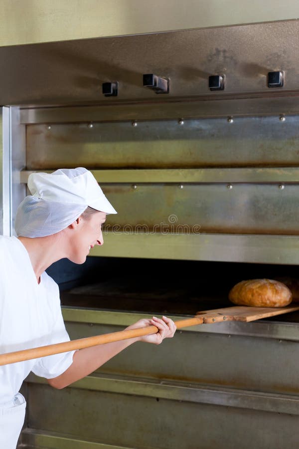 Female baker baking bread stock photo. Image of flavor - 32787470