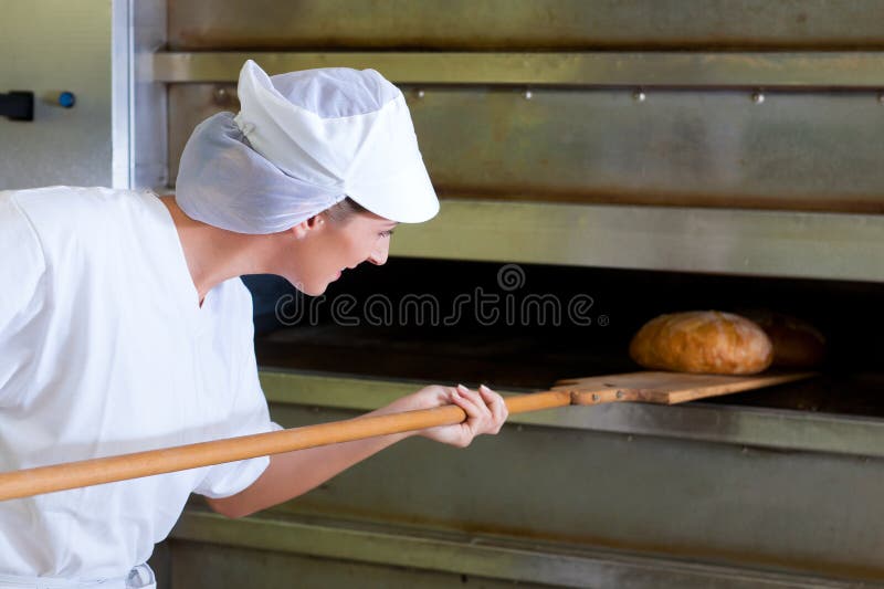 Female Baker Baking Fresh Bread in the Bakehouse Stock Image - Image of ...