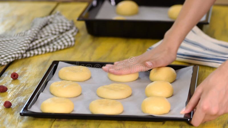Female Baker Cooking Buns in Kitchen. Stock Footage - Video of ...