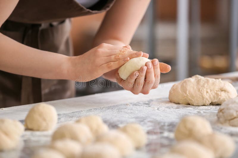 Female Baker Cooking Buns in Kitchen Stock Image - Image of buns ...