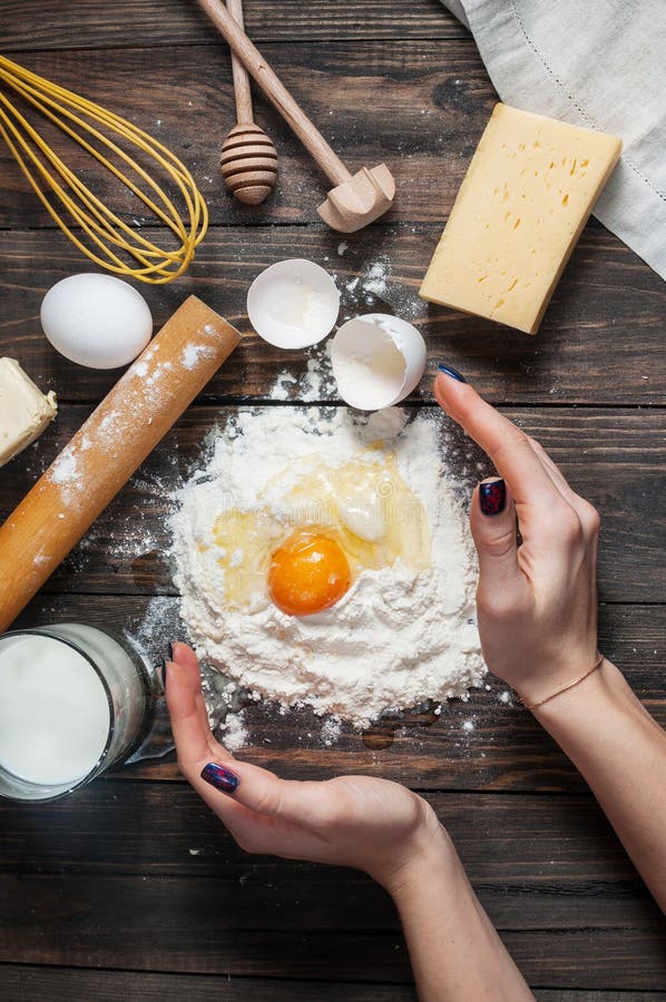 Female Baker Cooking Dough with Eggs, Butter and Milk Stock Image ...