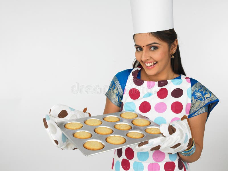 Female Baker with Her Cookies Stock Photo - Image of dots, drops: 6913124