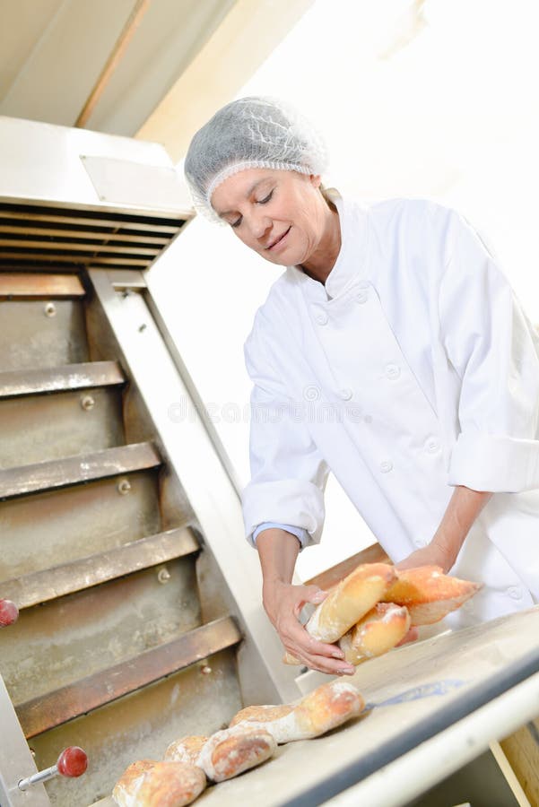 Female Baker Holding Bread Sticks Stock Photo - Image of bakery ...