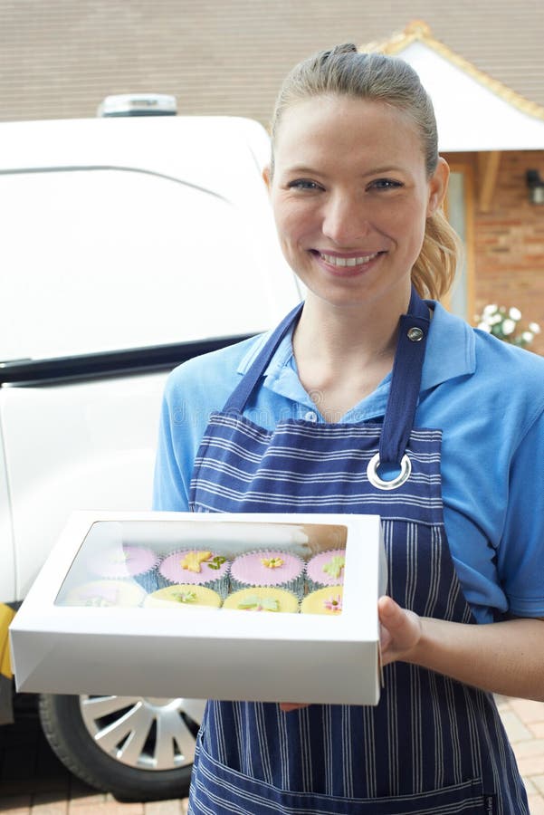 Female Baker Making Home Delivery of Cupcakes Stock Photo - Image of ...