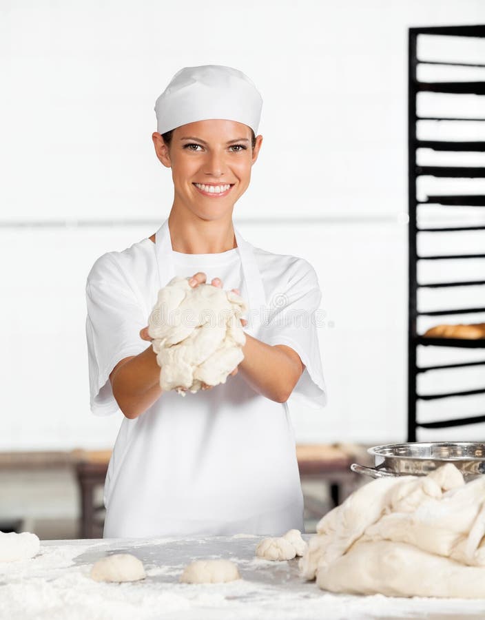 Female Baker Showing Dough at Table Stock Photo - Image of girl, female ...