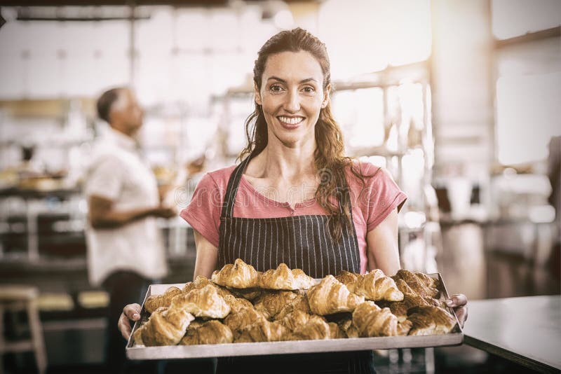 Female Baker Showing Tray of Fresh Croissants Stock Image - Image of ...