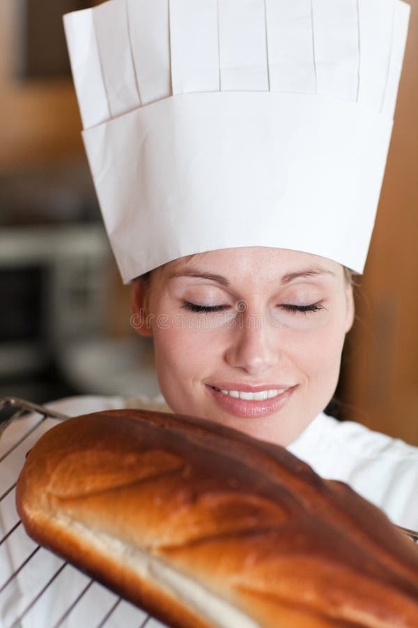 Female Baker Smelling a Bread Stock Image - Image of working, enjoying ...