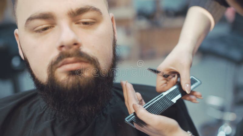 Female Barber Cuts the Beard Hair of the Male Client 4K Stock Video ...
