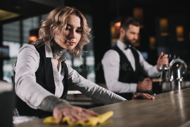 Female Bartender Cleaning Bar Stock Image - Image of ...