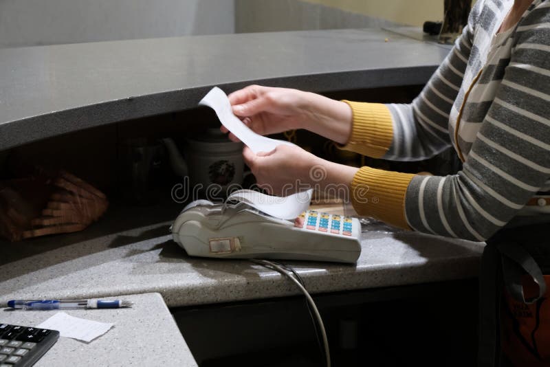 A Female Bartender Counts Money and Reads Documents on Acceptance of ...