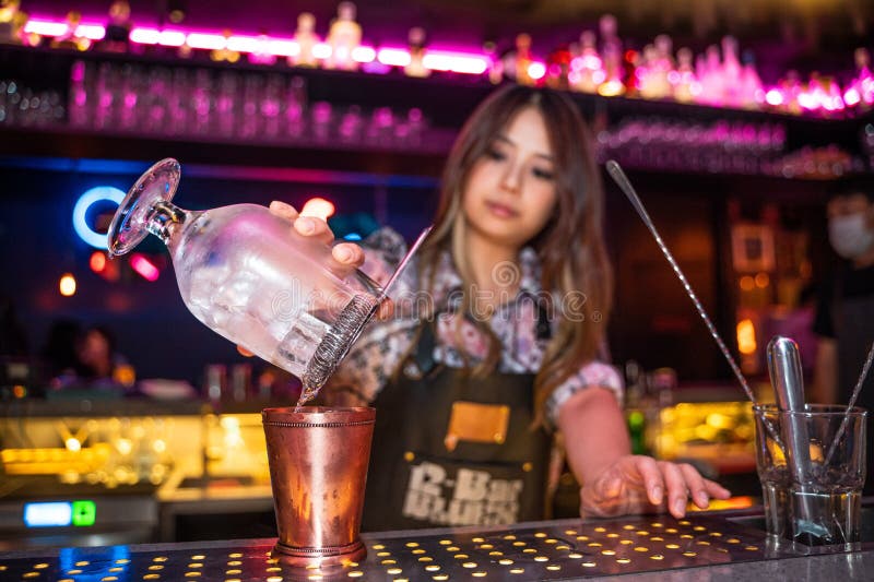 Female Bartender Mixing a Cocktail at a Bar Editorial Photo - Image of ...