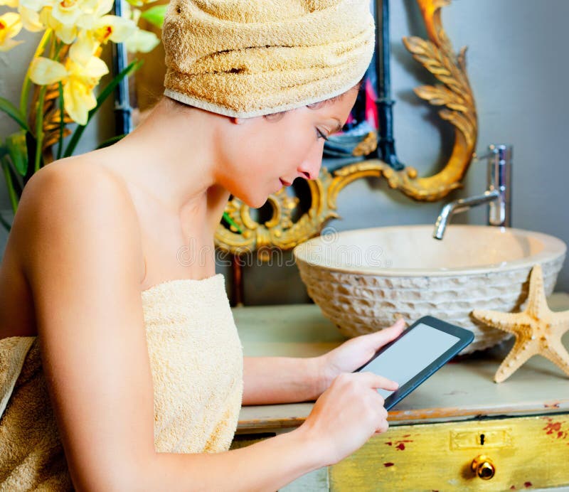 Female in Bathroom Reading Ebook Tablet Stock Photo - Image of keypad ...