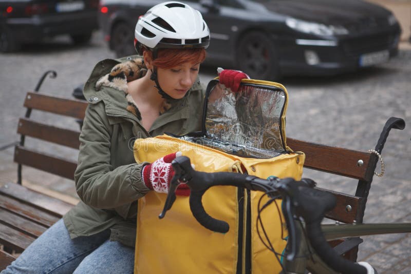 Female Delivery Courier Working on Her Bicycle Stock Image - Image of ...