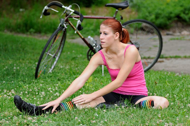 Female Bike Rider - Stretching Stock Image - Image of healthy, park ...