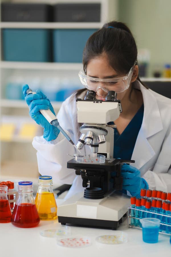 Female Biotechnologist Testing New Chemical Substances in a Laboratory ...