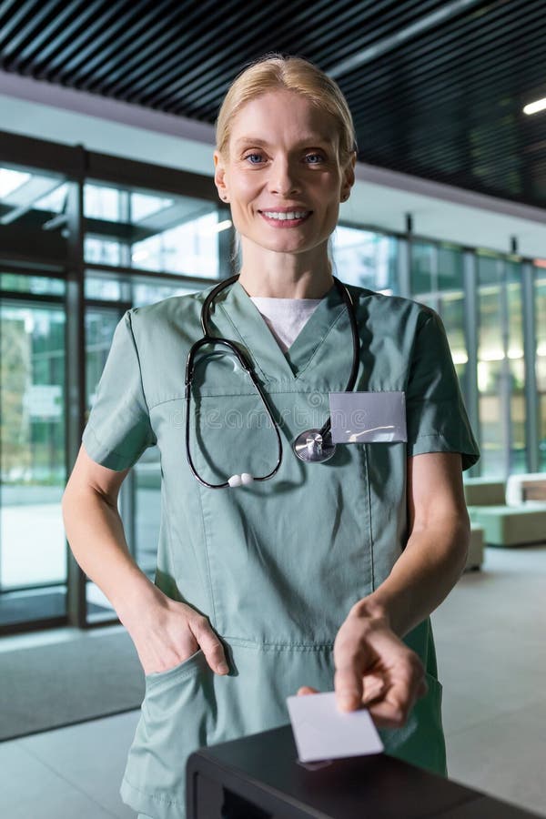 Female Blonde Doctor Passing through Security by Using Access Card ...