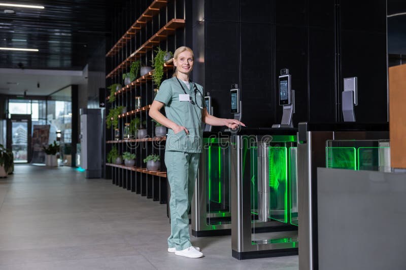 Female Blonde Doctor Passing through Security by Using Access Card ...