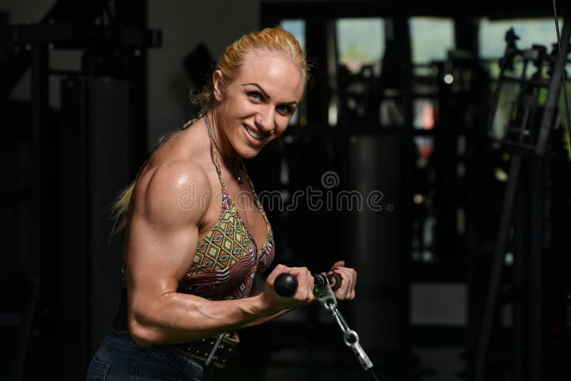 Female Bodybuilder Doing Heavy Weight Exercise for Biceps Stock Image ...