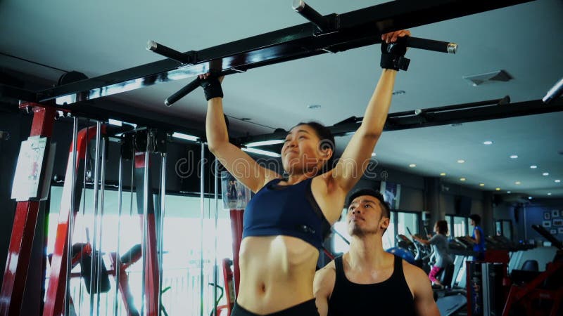 Female Bodybuilder Doing Lifting Her Body on the Simulator Stock Video ...