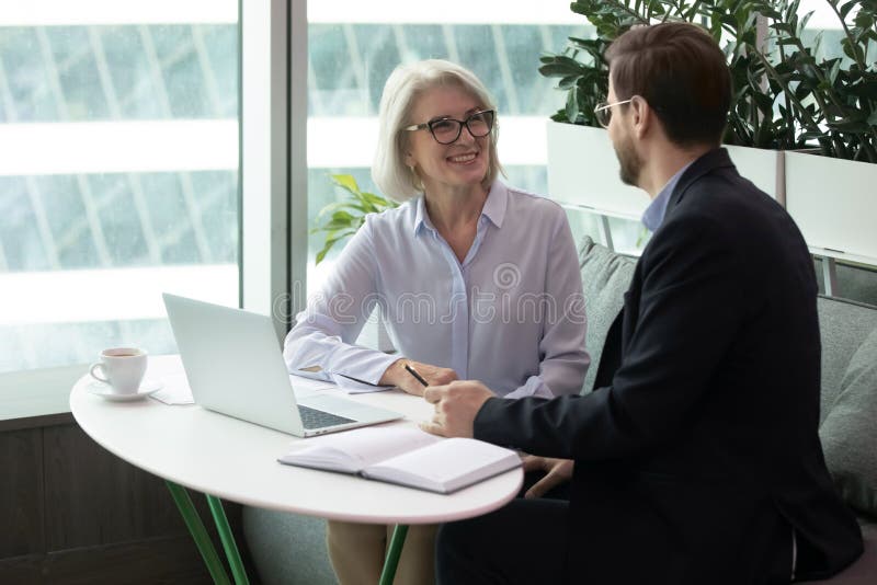 Female Boss Discusses Work Issues with Subordinate Stock Image - Image ...