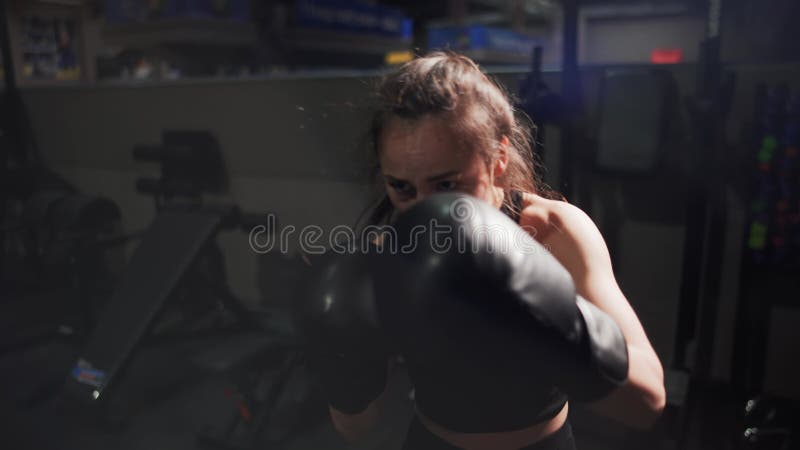 Female Boxer Punching Camera during Training in Gloves Stock Video ...