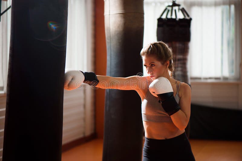 A Female Boxer Train Hard in a Boxing Studio. Stock Image - Image of ...