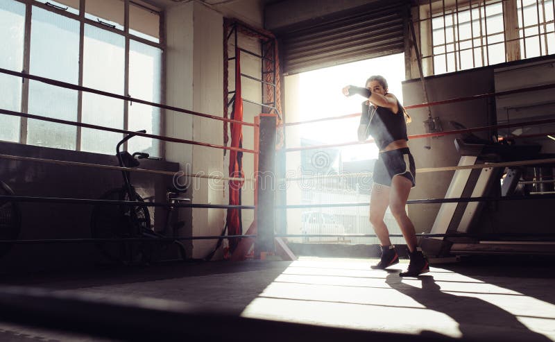 Female Boxer Training Inside a Boxing Ring Stock Image - Image of ...