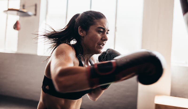 Female Boxer Training Inside a Boxing Ring Stock Photo - Image of ...