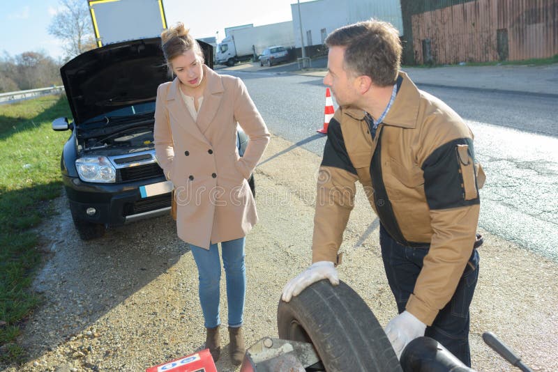 Female with Broken Car and Road Assistance Employee Stock Photo - Image ...