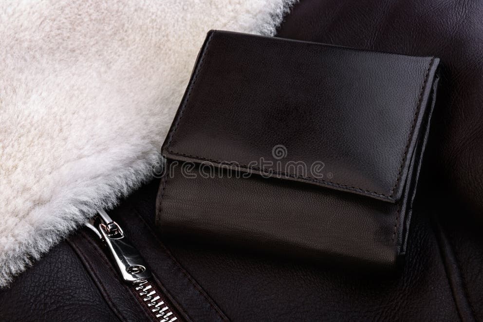 Female Brown Leather Wallet on Leather Jacket. Stock Image - Image of ...