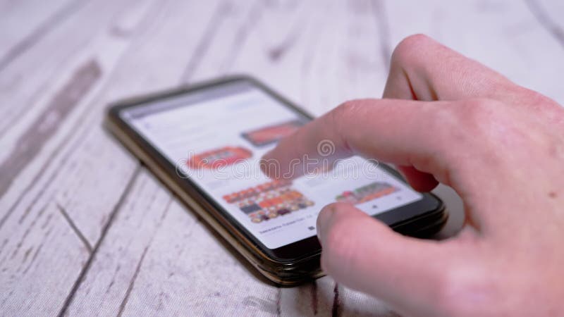 Female is Browsing the Internet Menu in a Smartphone for Ordering Sushi ...