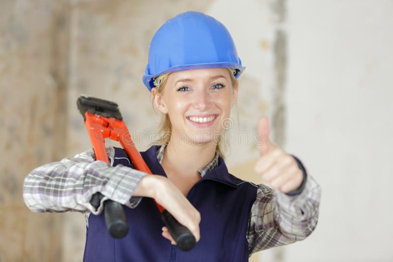 Female Builder in Helmet Shows Thumbs Stock Photo - Image of home ...