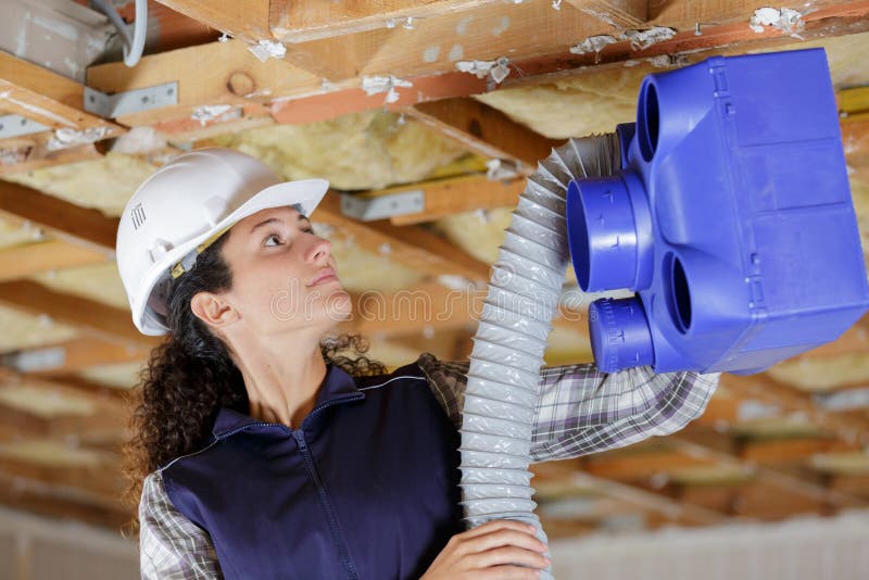 Female Builder Installing Pipes Stock Image - Image of business ...