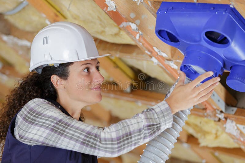 Female Builder Installing Ventilation System Stock Photo - Image of ...