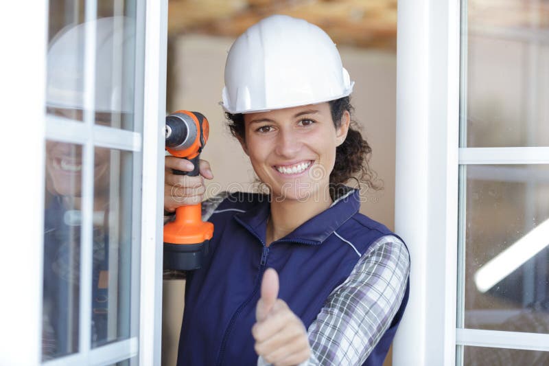 Female Builder Installing Window Stock Photo - Image of trade ...