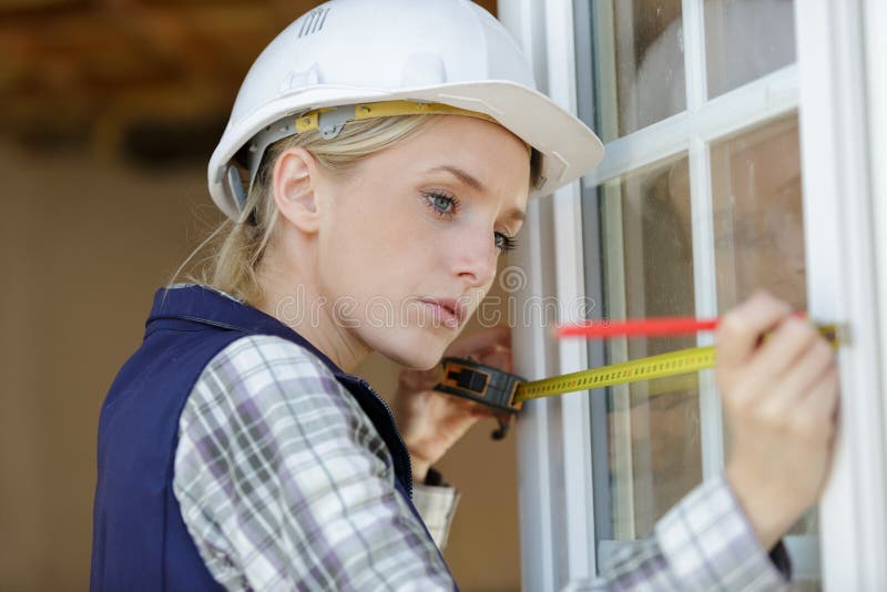 Female Builder Measuring Window Stock Photo - Image of adult, caucasian ...