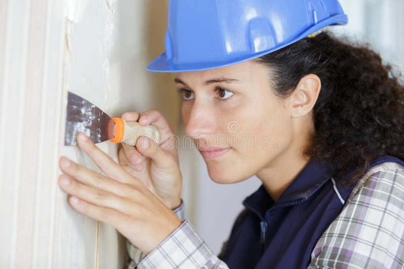 Female Builder Scraping Wallpaper Off Wall Stock Image - Image of work ...