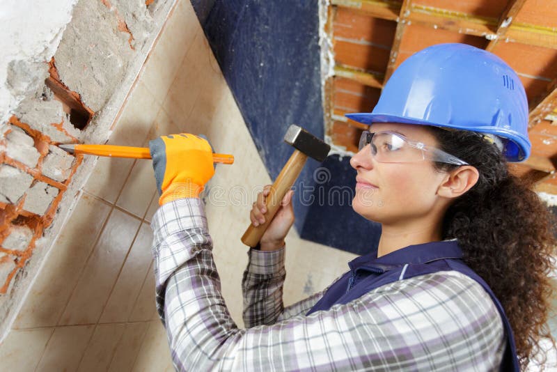Female Builder Using Hammer and Chisel Stock Image - Image of curlyhair ...