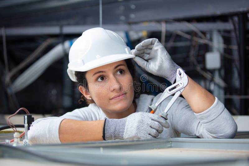 Female Builder Working on Building Ceiling Stock Image - Image of ...