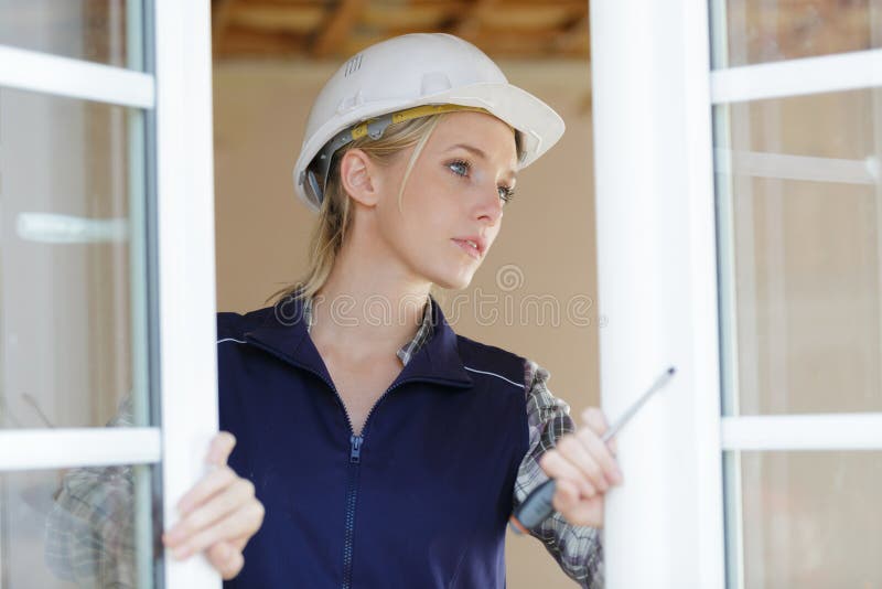 Female Builder Working on Window Stock Photo - Image of steel, building ...