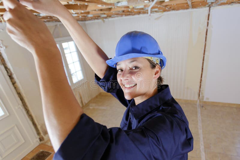 Female Builder Working on Wooden Ceiling Trusses Stock Image - Image of ...