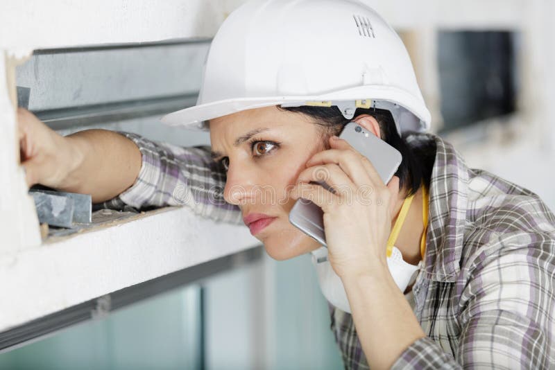 Female Building Contractor Using Smartphone Stock Photo - Image of ...