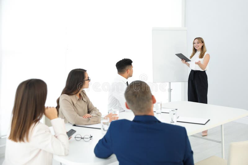 Female Business Coach Talking To Audience in Office Stock Image - Image ...