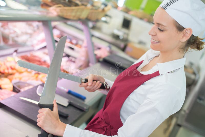 Working in Butchers Shop - Shop Assistant and Client Stock Photo ...
