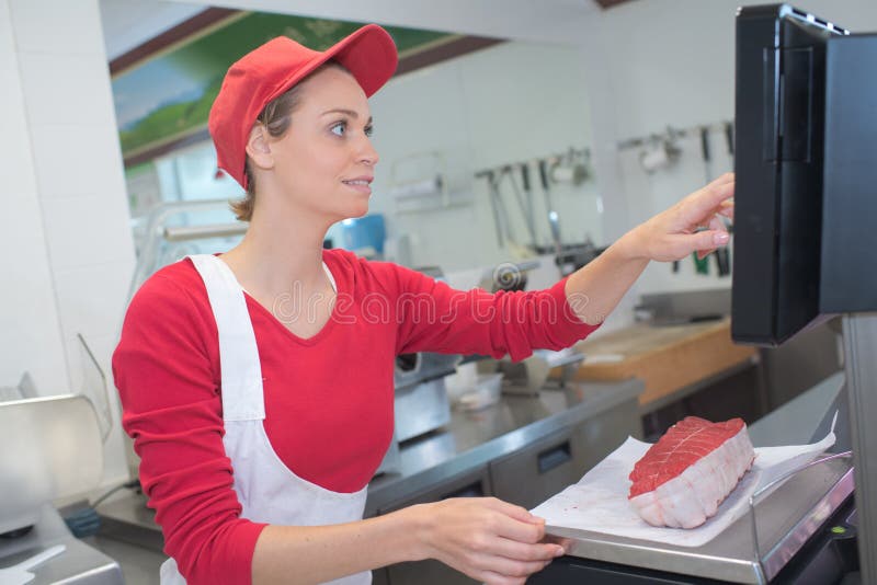 Working in Butchers Shop - Shop Assistant and Client Stock Photo ...