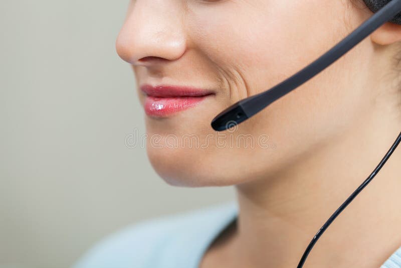 Female Call Center Employee Using Mic in Office Stock Image - Image of ...