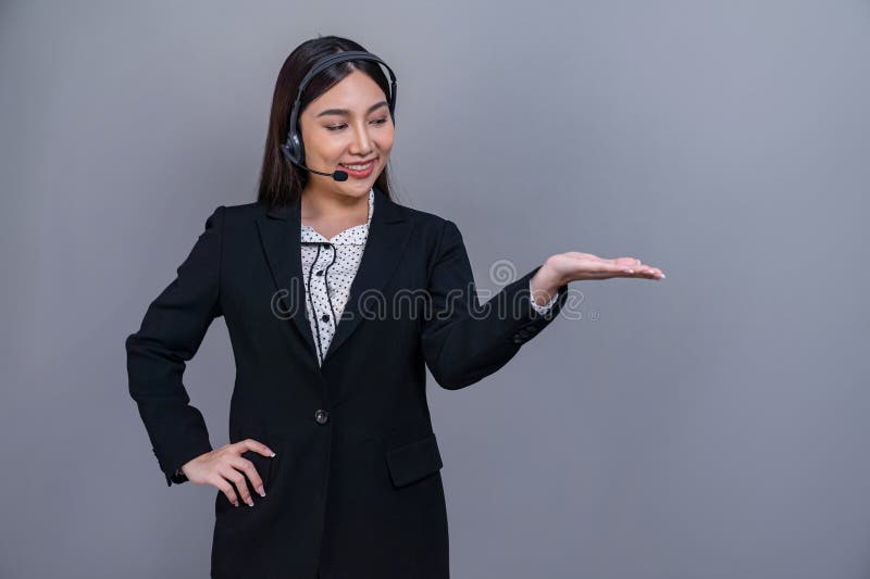 Female Call Center Operator Wearing Headset Making Hand Gesture ... Female Call Center Operator Wearing Headset Making Hand Gesture ...
