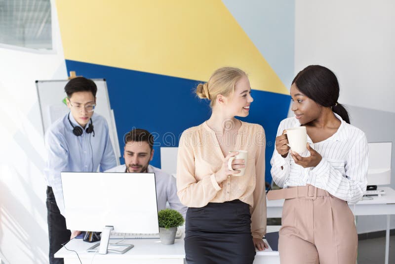 Female Call Centre Operators Having Coffee and Talking during Their ...