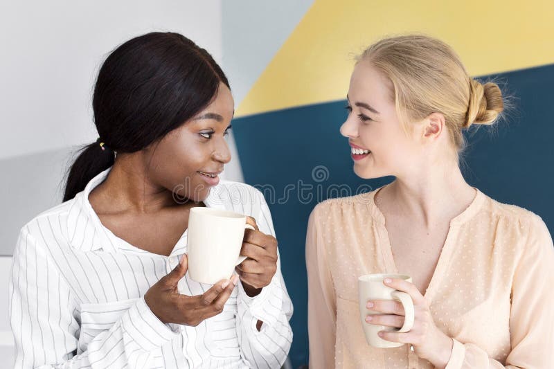 Female Call Centre Operators Having Coffee and Talking during Their ...