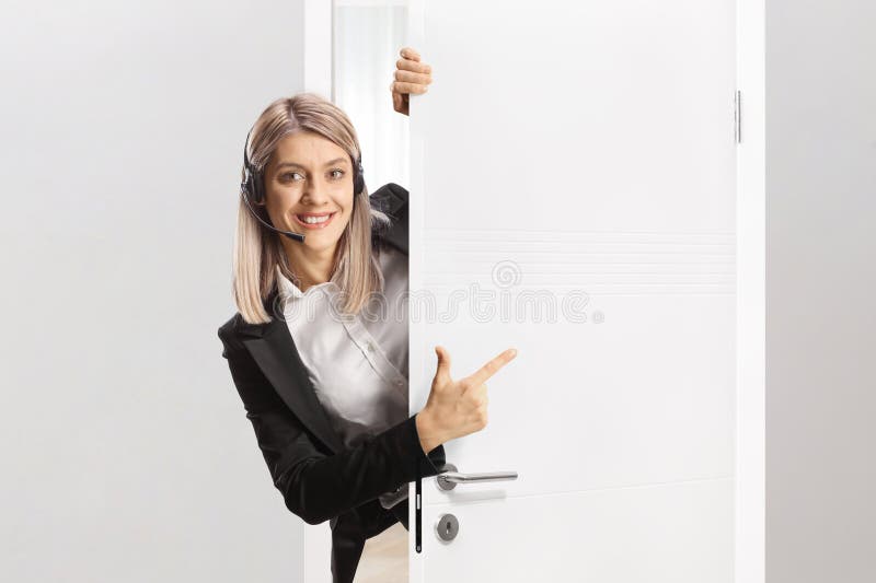 Female Call Operator with a Headset Standing Behind a Door Stock Image ...